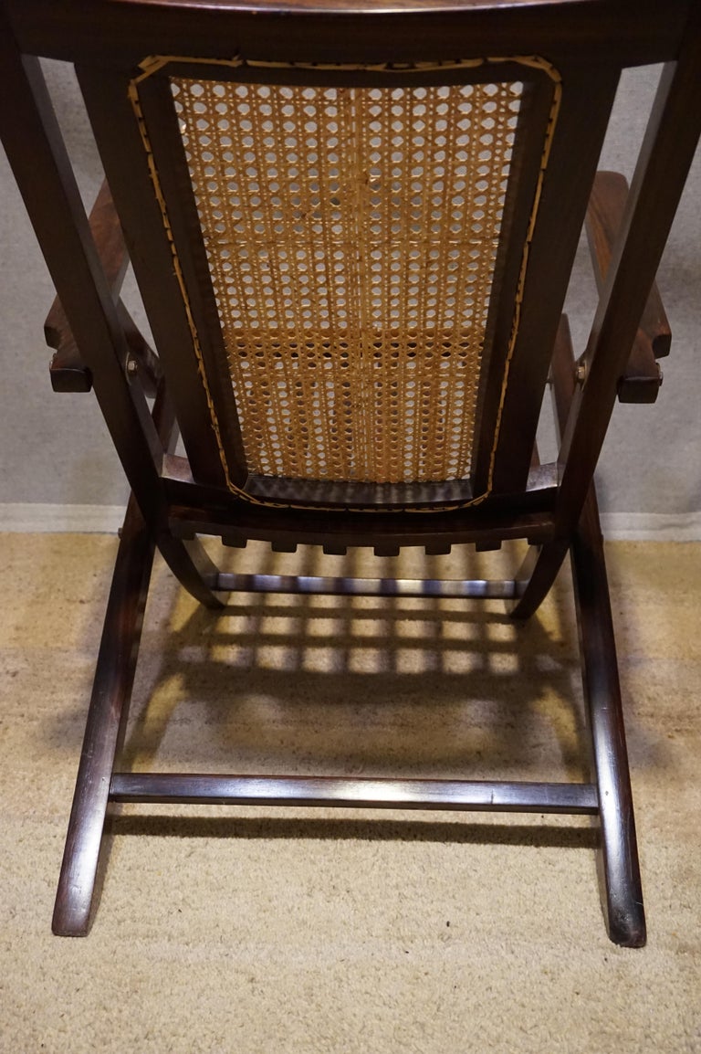 British Colonial Folding Campaign Chair with Cane Work and Bolts at 1stDibs