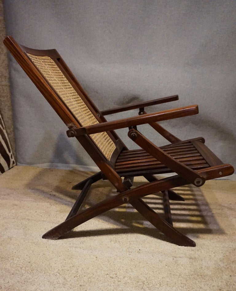 British Colonial Folding Campaign Chair with Cane Work and Bolts at 1stDibs