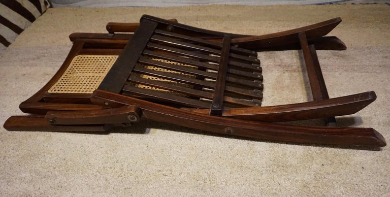 British Colonial Folding Campaign Chair with Cane Work and Bolts at 1stDibs