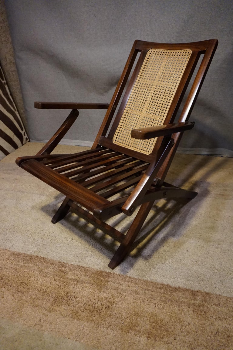 British Colonial Folding Campaign Chair with Cane Work and Bolts at 1stDibs