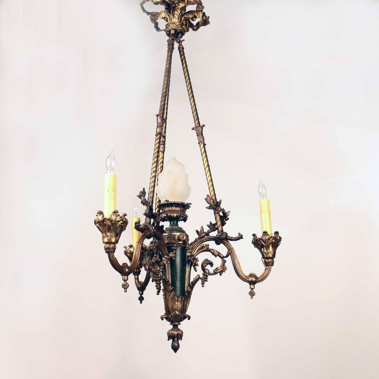 Bronze Gasolier Modeled with a Central Flambeau Shade at 1stDibs