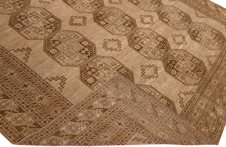 Brown Antique Turkmen Handmade Wool Rug With Gul Motif For Sale at 1stDibs