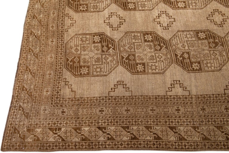 Brown Antique Turkmen Handmade Wool Rug With Gul Motif For Sale at 1stDibs