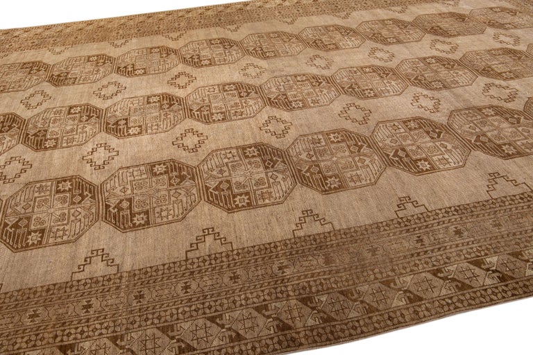 Brown Antique Turkmen Handmade Wool Rug With Gul Motif For Sale at 1stDibs