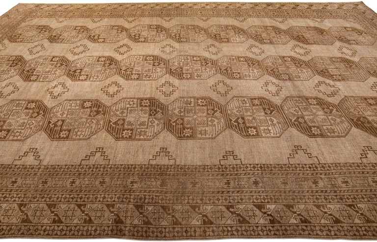 Brown Antique Turkmen Handmade Wool Rug With Gul Motif For Sale at 1stDibs