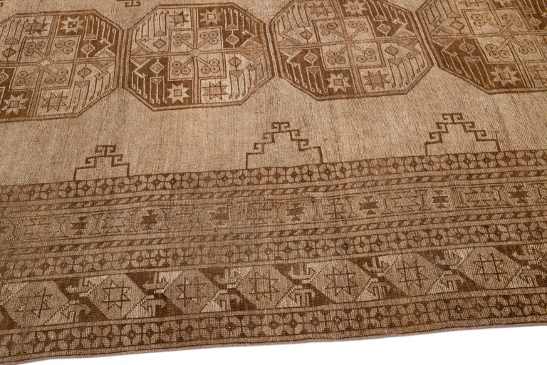 Brown Antique Turkmen Handmade Wool Rug With Gul Motif For Sale at 1stDibs