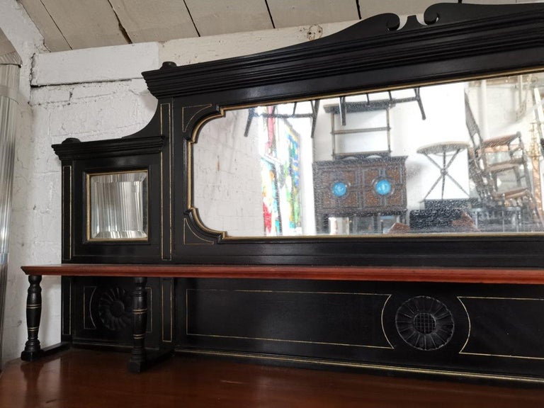 Bruce Talbert, attr An Ebonised Side Cabinet Carved with Putti playing ...