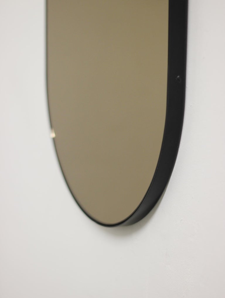 Capsula Capsule shaped Bronze Contemporary Mirror with Black Frame ...