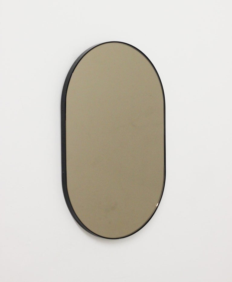 Capsula Capsule shaped Bronze Contemporary Mirror with Black Frame ...