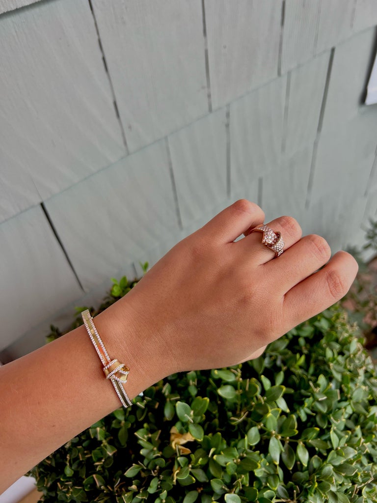 Carelle 18 Karat Yellow Gold Brushed Satin Knot Diamond Trim Bangle For Sale at 1stDibs