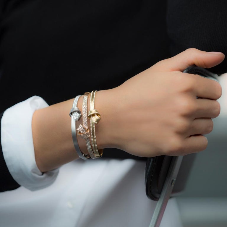 Carelle 18 Karat Yellow Gold Brushed Satin Knot Diamond Trim Bangle For Sale at 1stDibs