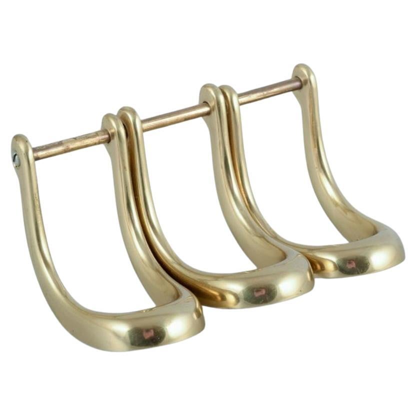 Carl Auböck (1900-1957), adjustable pipe holder in brass for three ...