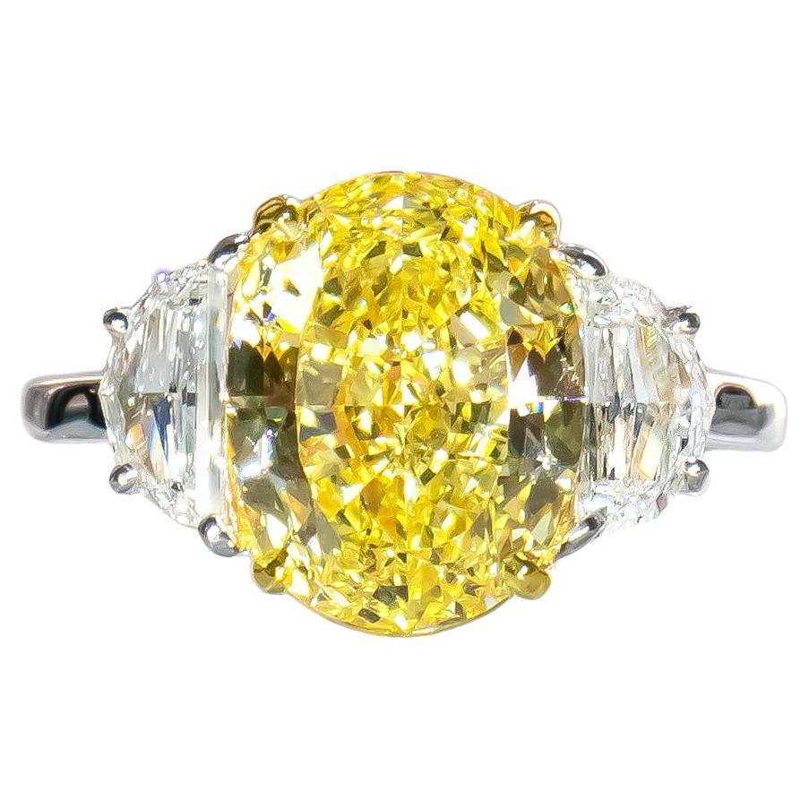3ct Fancy Intense Yellow Oval Diamond Three Stone Ring For Sale at 1stDibs