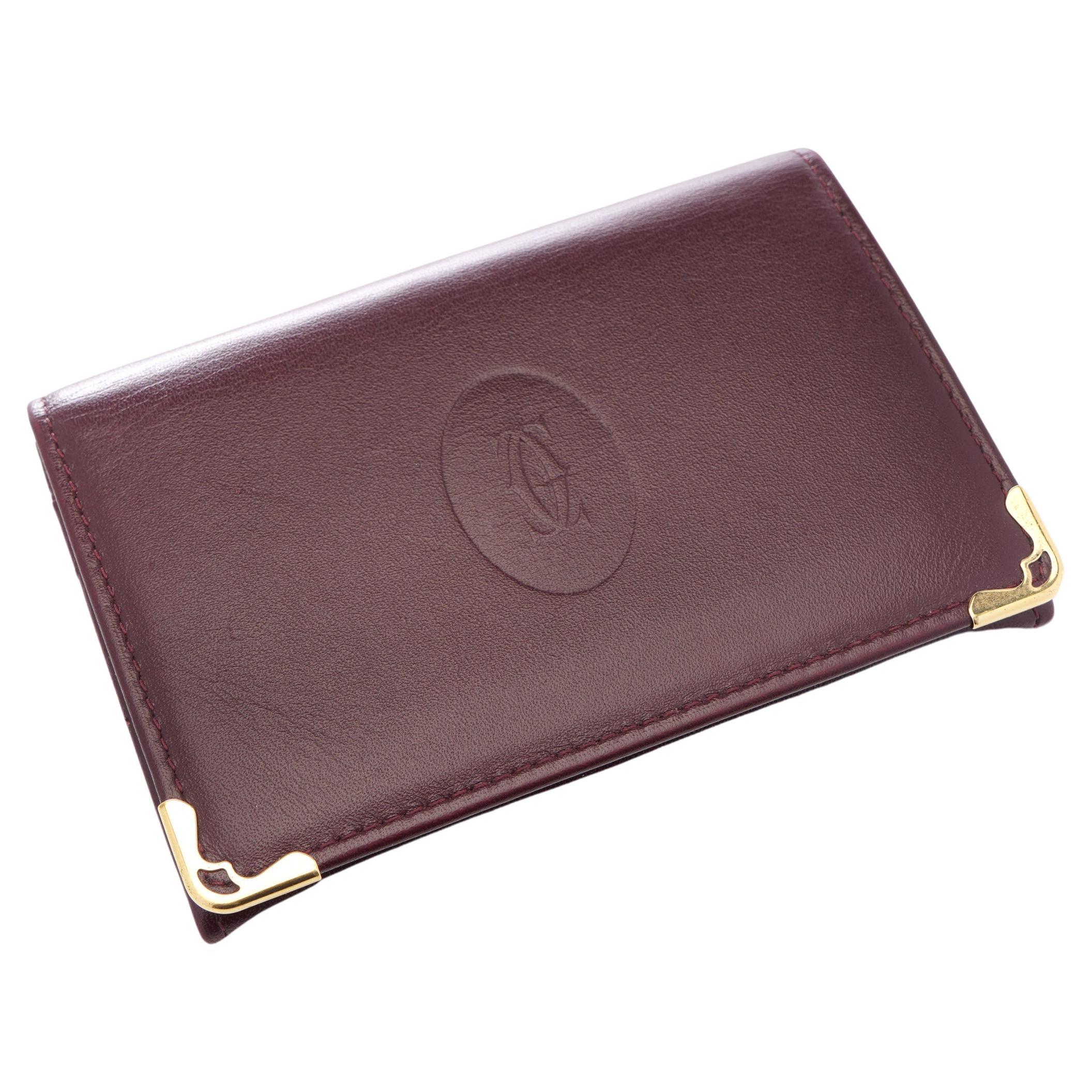 Cartier Burgundy calfskin wallet. in original box. For Sale at 1stDibs