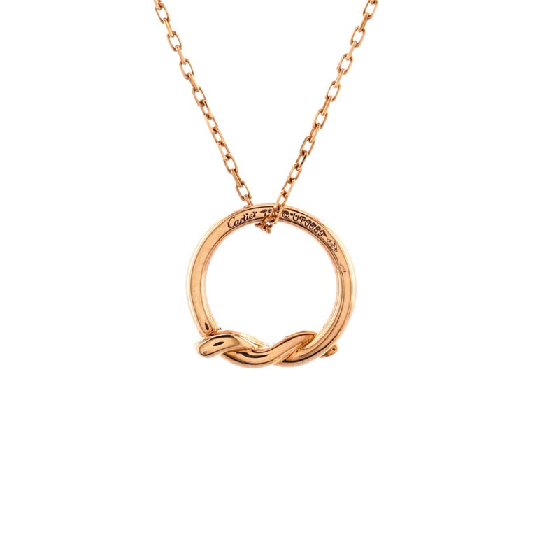 Cartier, collier pendentif cercle entrelacé en or rose 18 carats et ...