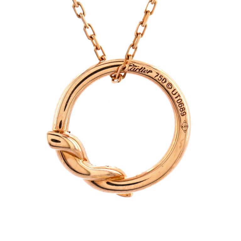 Cartier, collier pendentif cercle entrelacé en or rose 18 carats et ...
