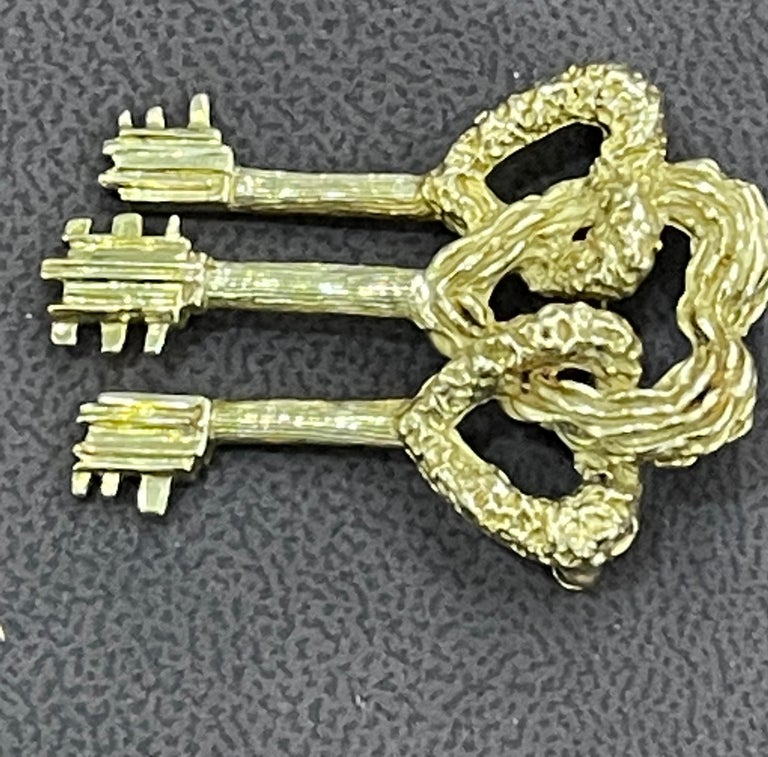 Cartier Key to My Heart 18 Karat Yellow Gold Three Heart Textured Key ...