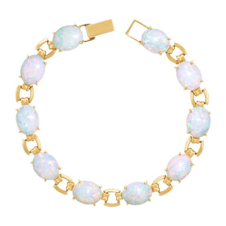 Bracelet Cartier en or serti d'opales sur 1stDibs