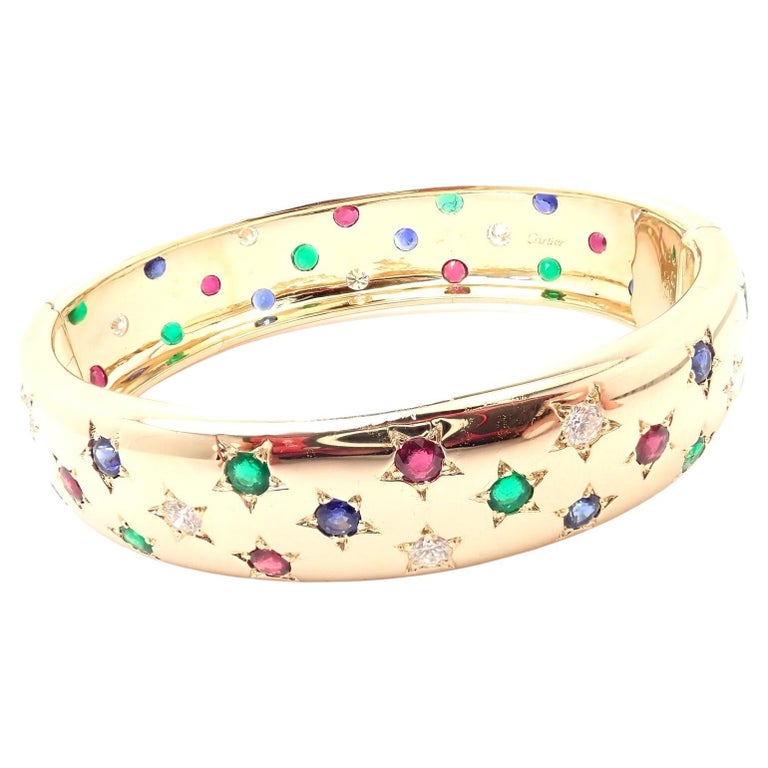 Cartier Star Diamond Ruby Emerald Sapphire Yellow Gold Bangle Bracelet For Sale at 1stDibs