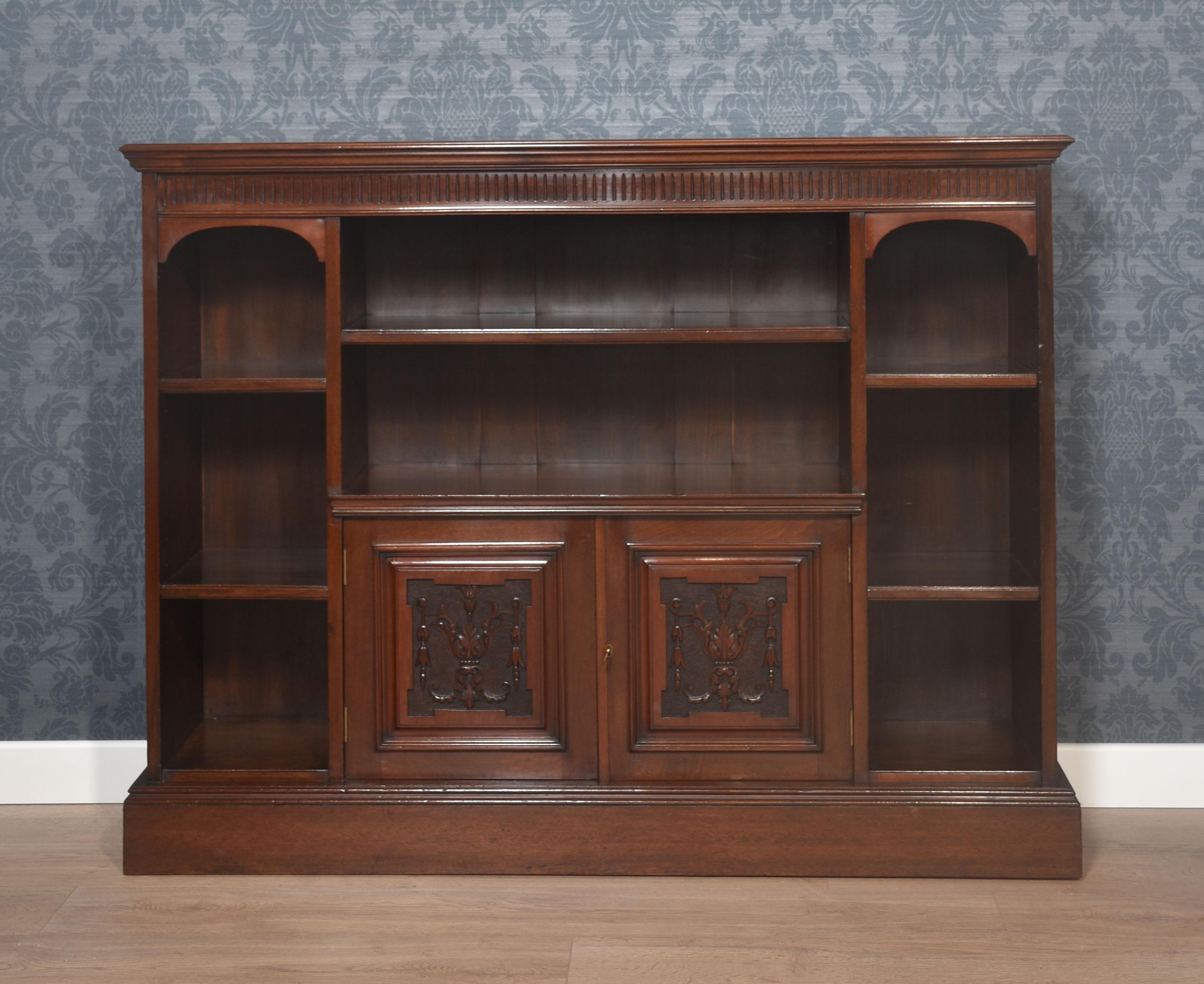 Carved walnut open bookcase For Sale at 1stDibs