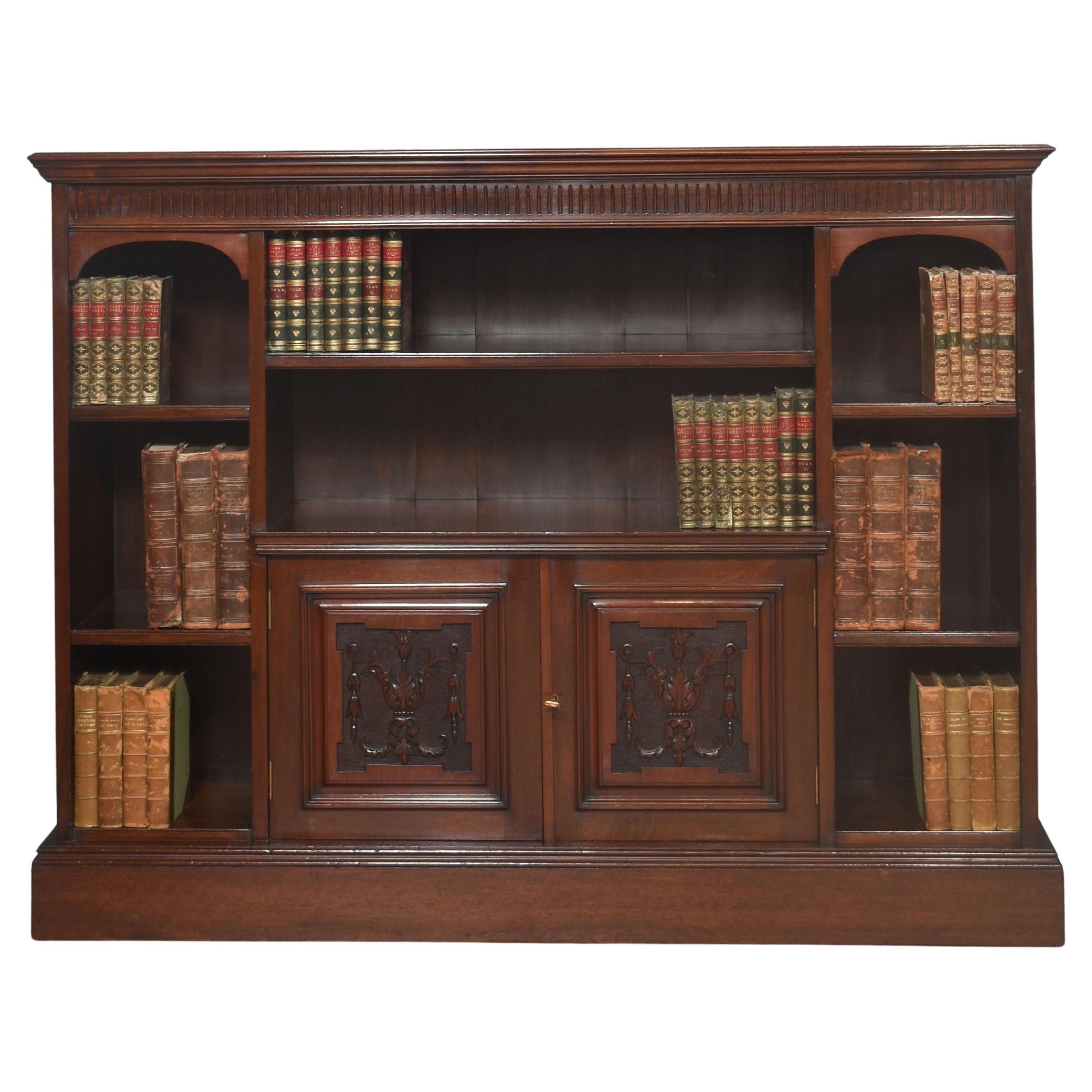 Carved walnut open bookcase For Sale at 1stDibs