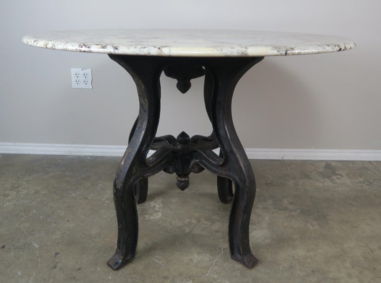 Cast Iron and Travertine Top Table at 1stDibs
