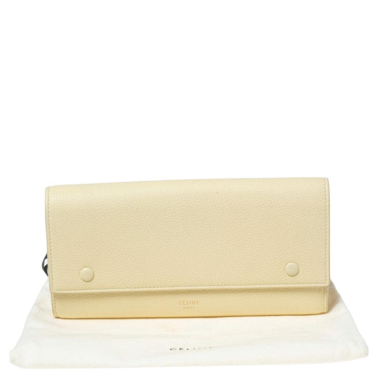 Celine Light Yellow Leather Multifunction Flap Wallet at 1stDibs