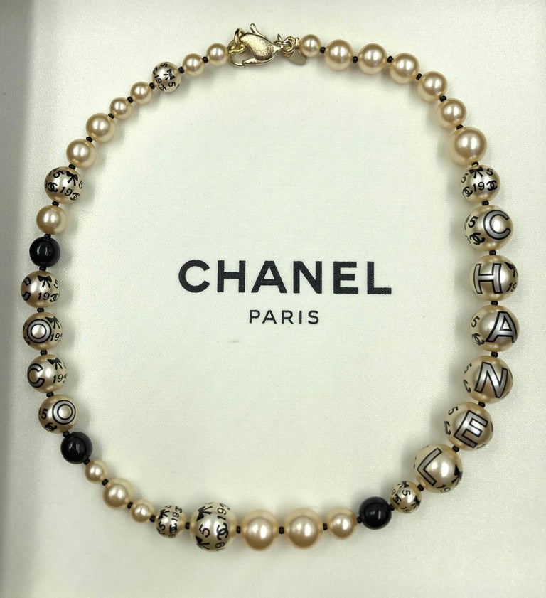 Chanel 1990's Faux Pearls with Coco Chanel Print on Strand For Sale at ...