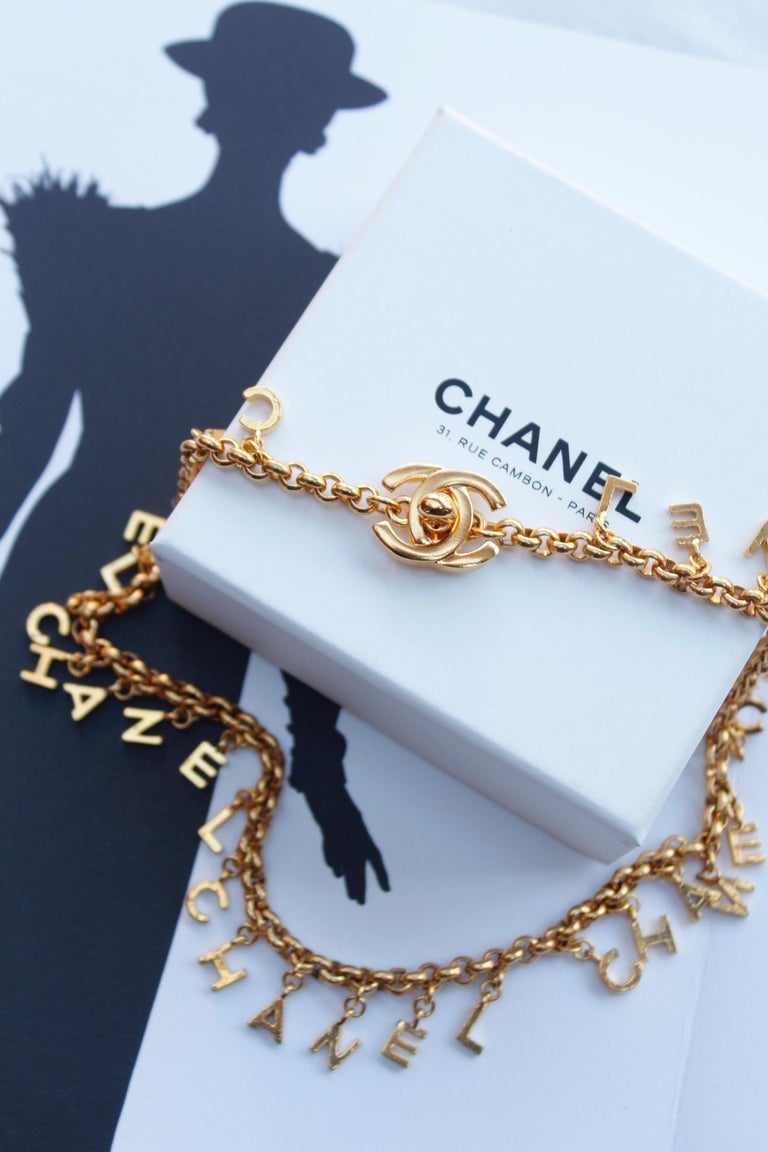 CHANEL 1996P Gilted metal chain with "Chanel" letters charms at 1stDibs