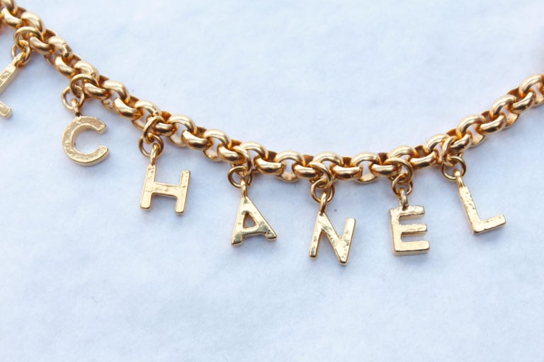 CHANEL 1996P Gilted metal chain with "Chanel" letters charms at 1stDibs