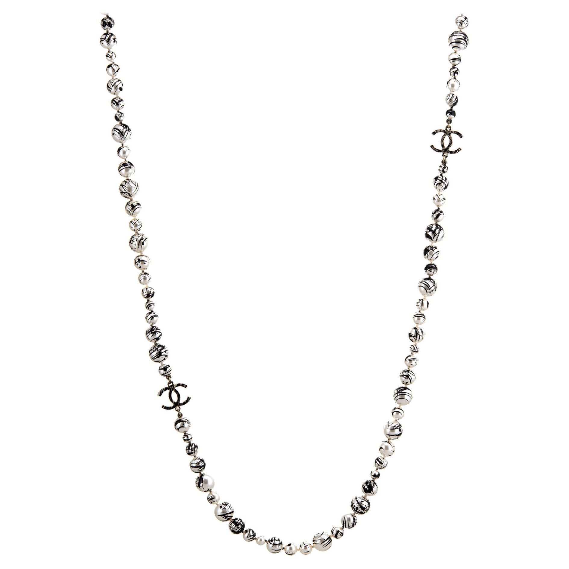 Chanel Fake Pearls and Charms Necklace with Chanel Doll Pendant at ...