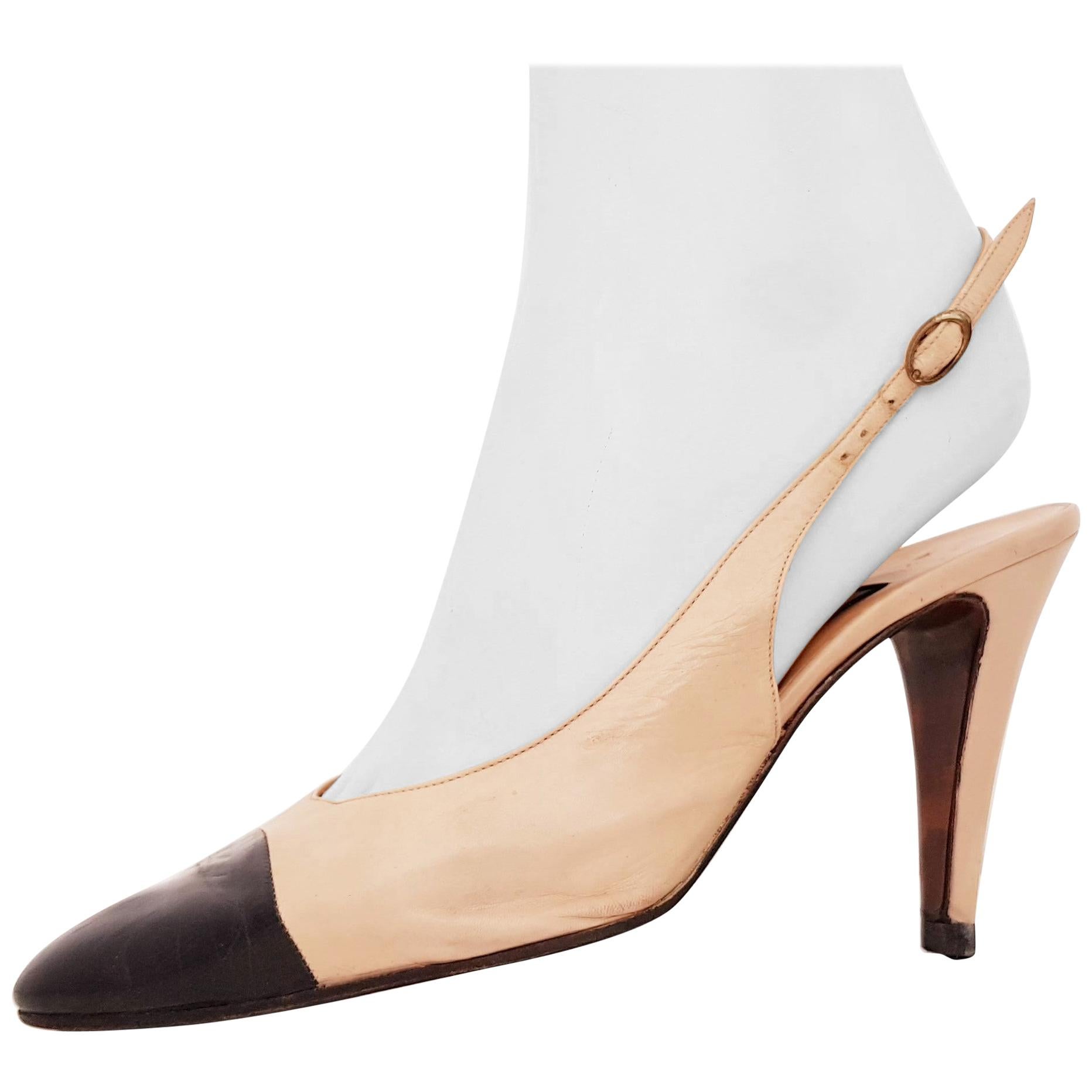 Chanel Beige Leather Heels with Black tip and small belt behind. For ...