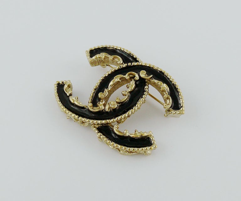 Chanel Black Enamel Baroque Logo Brooch at 1stDibs