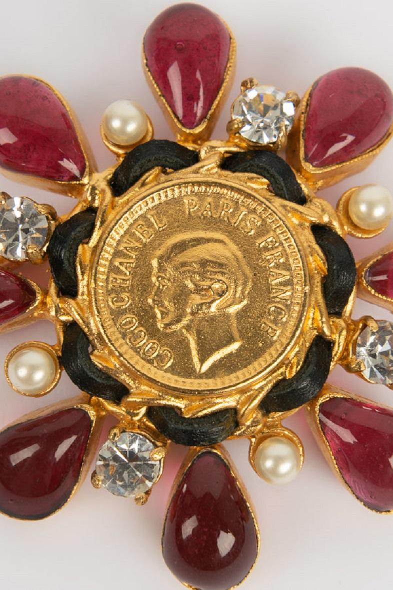 Chanel Brooch in Gold Metal, Black Leather, Rhinestones and Red Glass ...