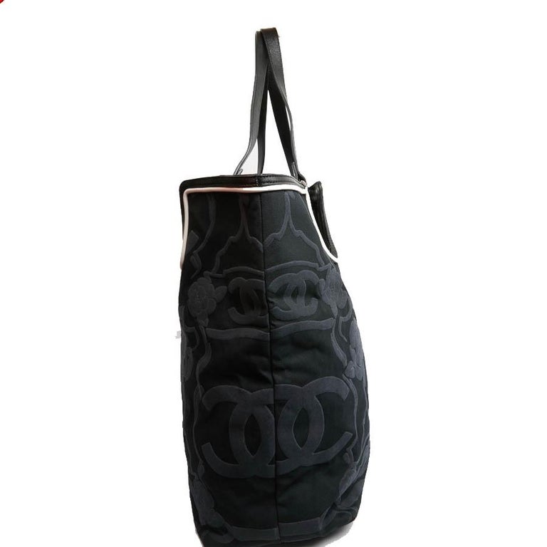 CHANEL Camellia And CC Embossed Canvas Tote Bag at 1stDibs | chanel ...