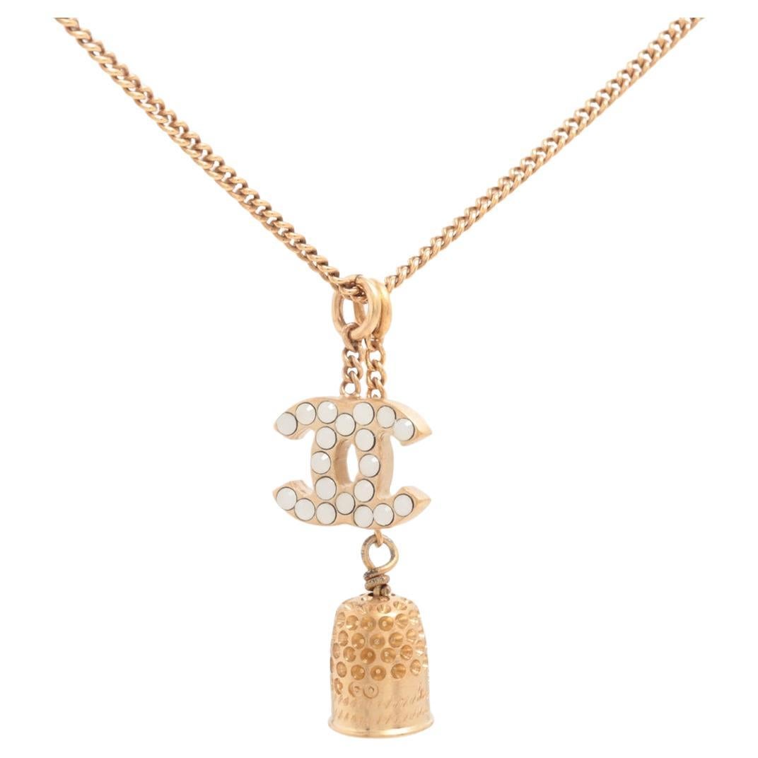 Chanel CC Logo Rhinestone with Bell Pendant Necklace For Sale at 1stDibs