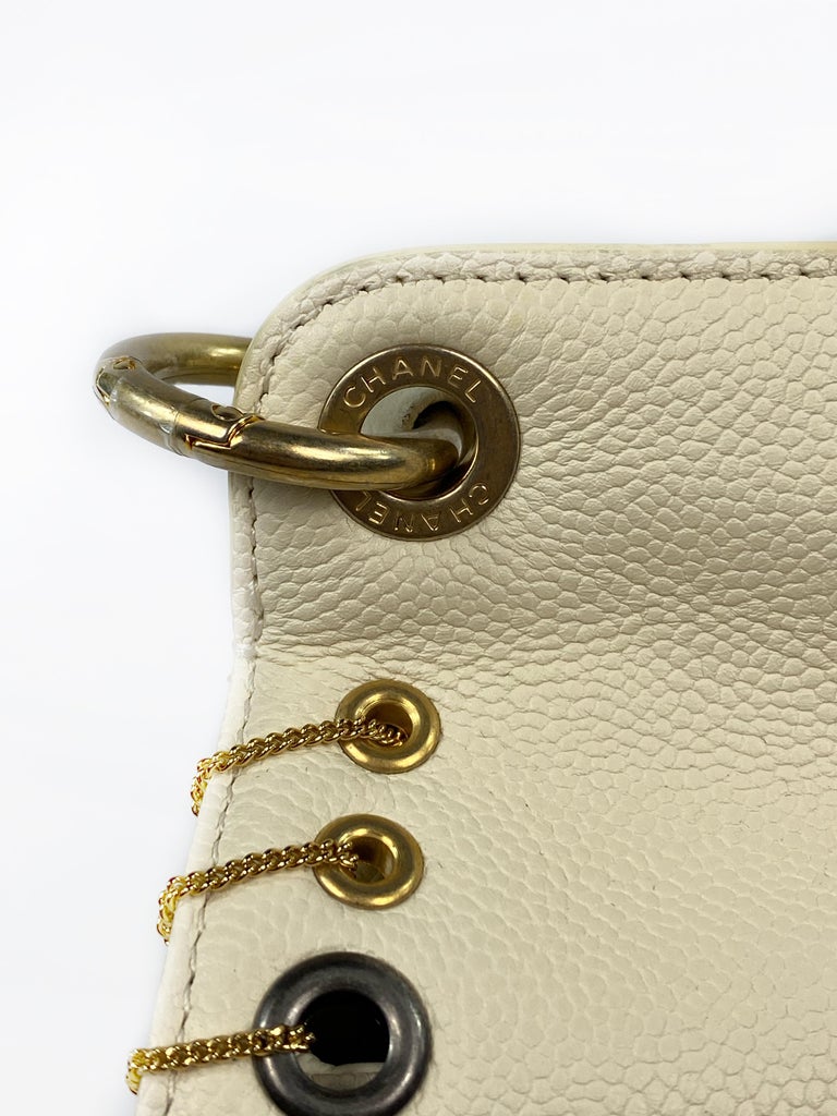 CHANEL Cream/ Ivory Caviar Quilted Grommet Embellished Piercing Flap ...