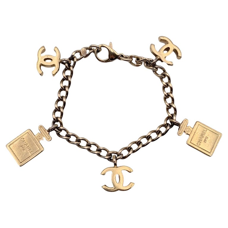 Chanel Gold Metal Chain Logo Bracelet with Perfume Charms For Sale at ...