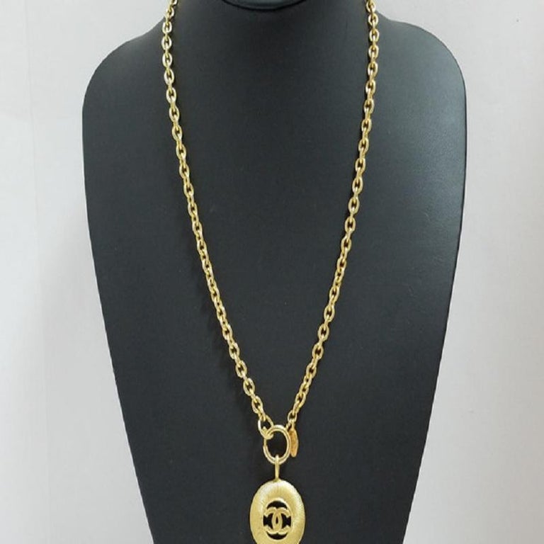 Chanel Gold-tone Metal CC Logo Cutout Sunburst Pendant Necklace at 1stDibs