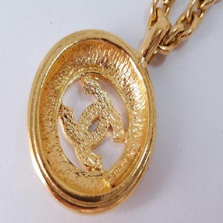 Chanel Gold-Tone Metal CC Logo Sunburst Pendant Necklace at 1stDibs