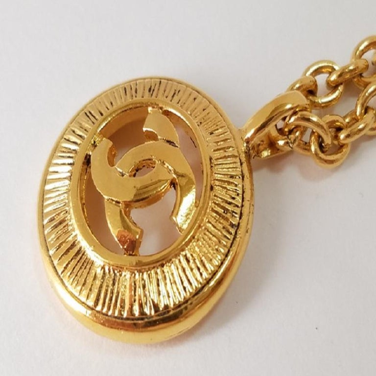 Chanel Gold-Tone Metal CC Logo Sunburst Pendant Necklace at 1stDibs