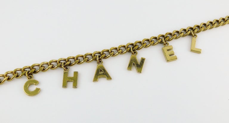 Chanel Gold Toned CC Logo and Letter Charms Chain Belt at 1stDibs