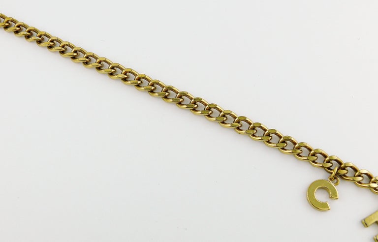 Chanel Gold Toned CC Logo and Letter Charms Chain Belt at 1stDibs