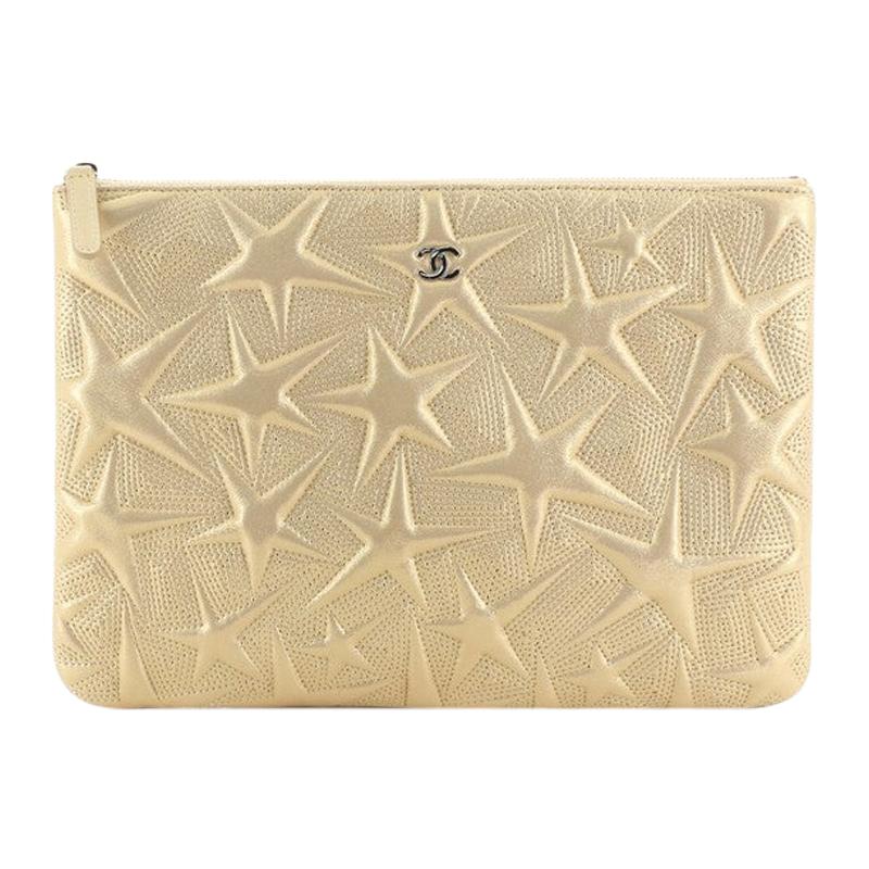 Chanel O Case Clutch Star Embossed Lambskin Medium at 1stDibs