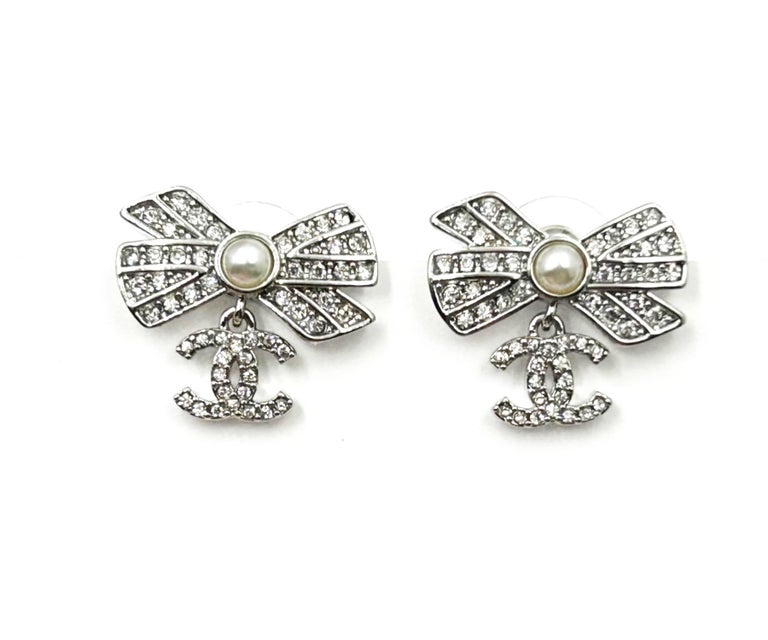 Chanel Silver Ribbon Row CC Crystal Piercing Earrings For Sale at 1stDibs