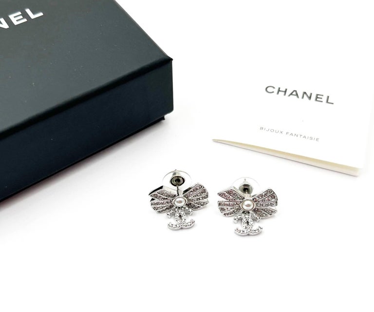 Chanel Silver Ribbon Row CC Crystal Piercing Earrings For Sale at 1stDibs