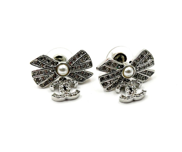 Chanel Silver Ribbon Row CC Crystal Piercing Earrings For Sale at 1stDibs