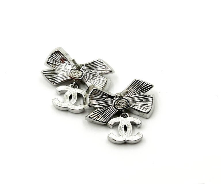Chanel Silver Ribbon Row CC Crystal Piercing Earrings For Sale at 1stDibs