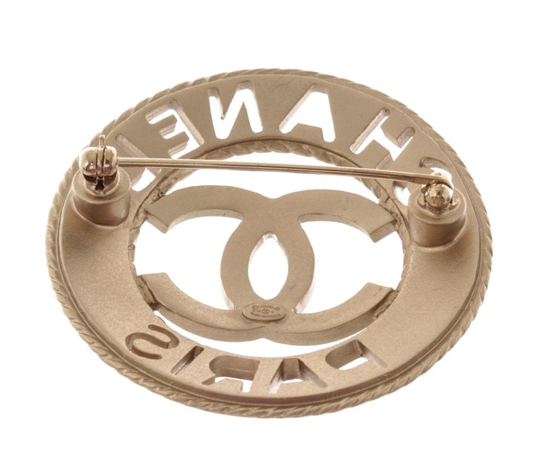 Chanel Silver-Tone Metal CC Paris Round Brooch For Sale at 1stDibs
