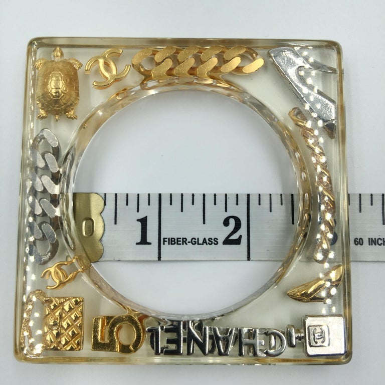 Chanel Square Lucite Bangle with Gold and Silver Inlaid Charms For Sale ...